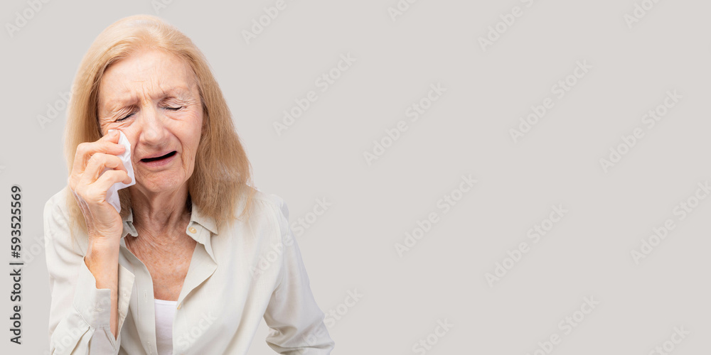Uneasy distressed old lady feeling sad crying and sobbing wipe tears ...