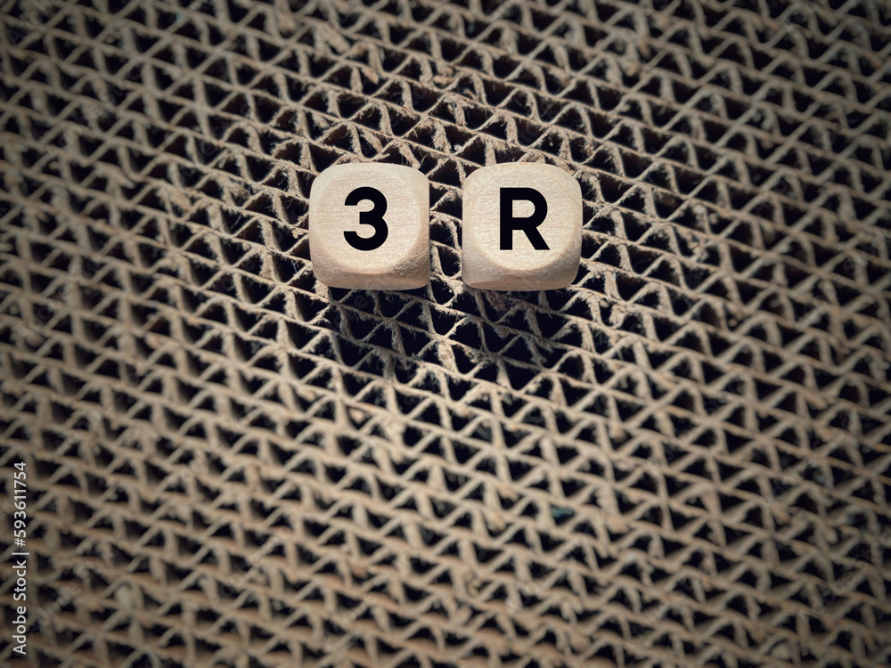 3r text on wooden cubes with corrugated paper background. Reduce reuse ...