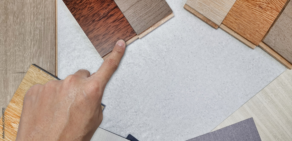 architect's hand choosing modern inspired interior finishing material ...