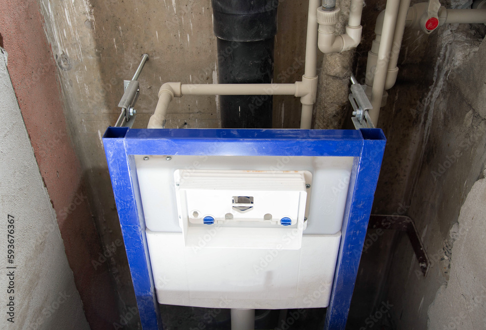 Installation of a new wall-hung toilet with a water drain installation ...