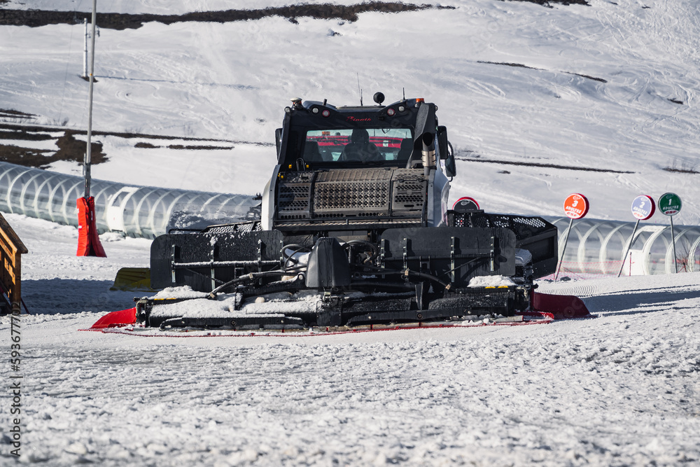 Huez, France - 9 April 2023: Snowcat, ratrack PistenBully - machine for ...