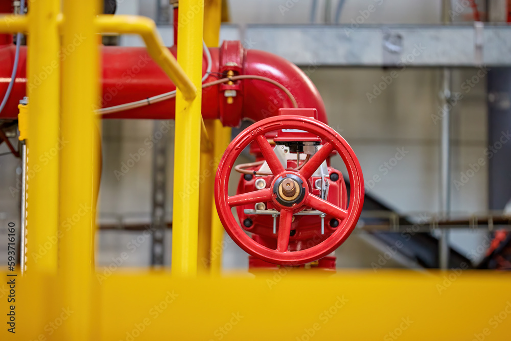 Red fire water valve on the piping system of the industrial ...