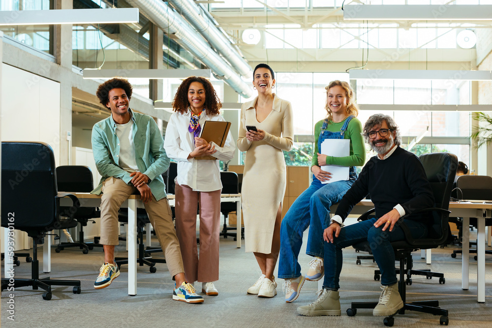 Group of diverse colleagues smiling in modern office Stock Photo ...