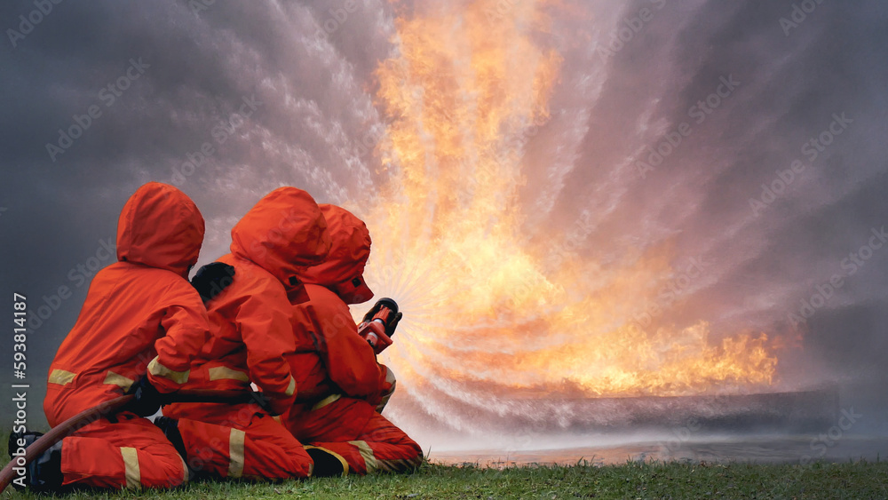 Firefighter Rescue team training in fire fighting extinguisher ...