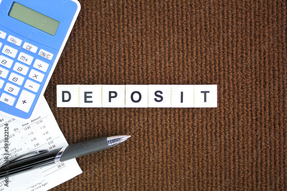 pen, calculator and receipt with the word deposit. the concept of ...