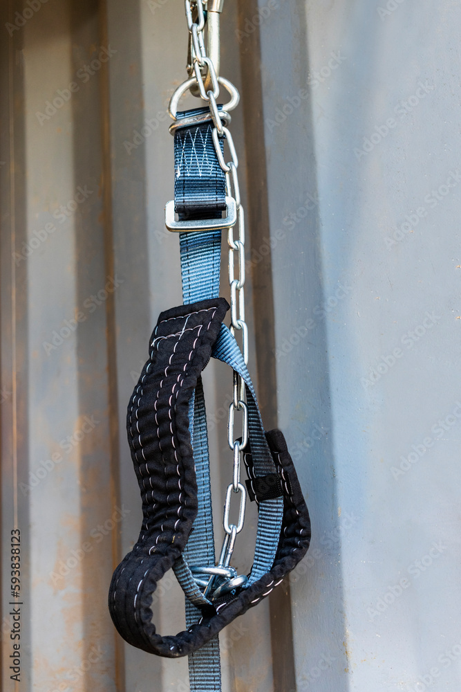 Construction worker wearing safety harness and safety line working at ...