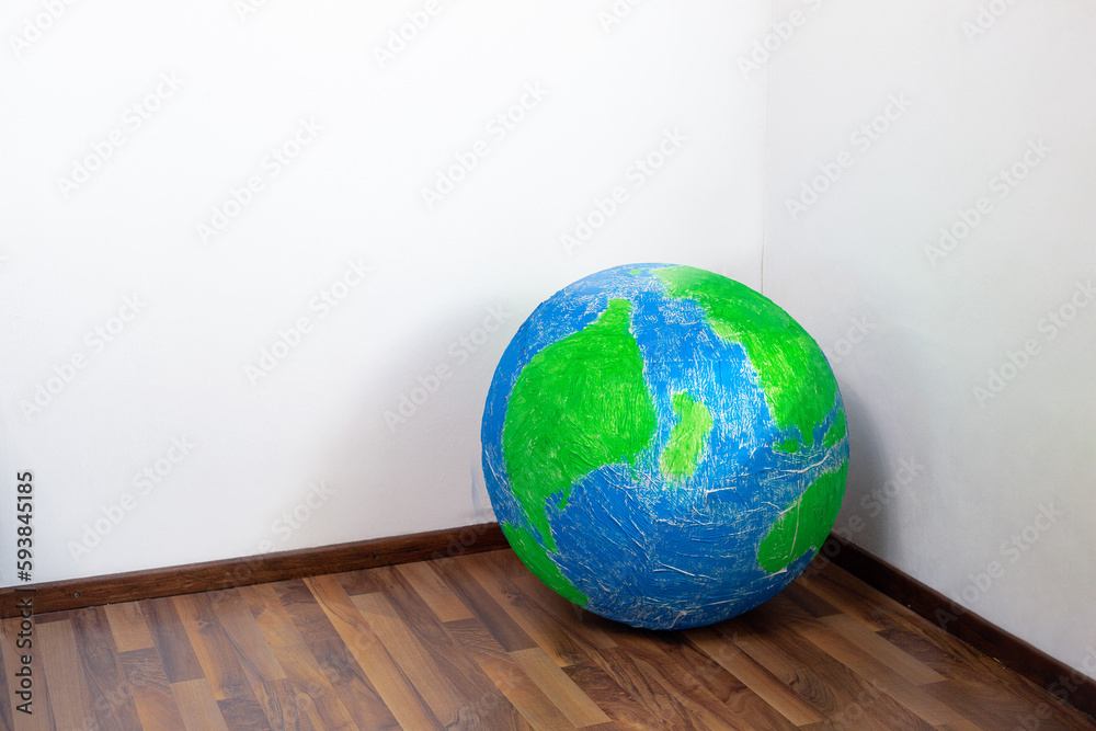 Eco problem. Planet earth in the corner of the room. Surrealism. Stock ...