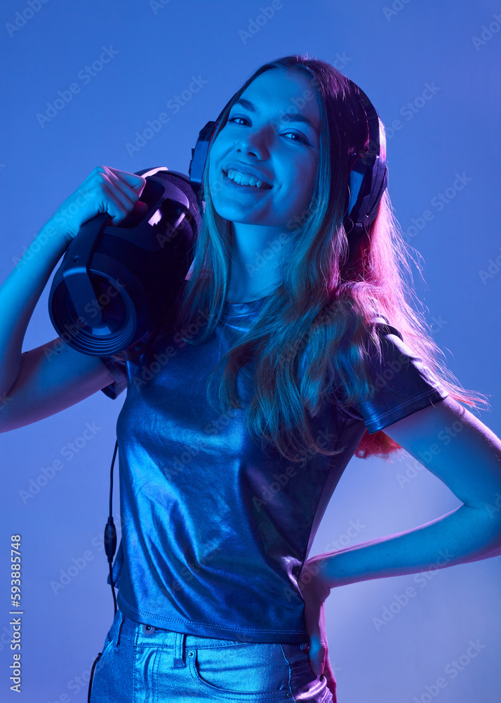 Stylish fashion teenager model with headphones listening dj music ...