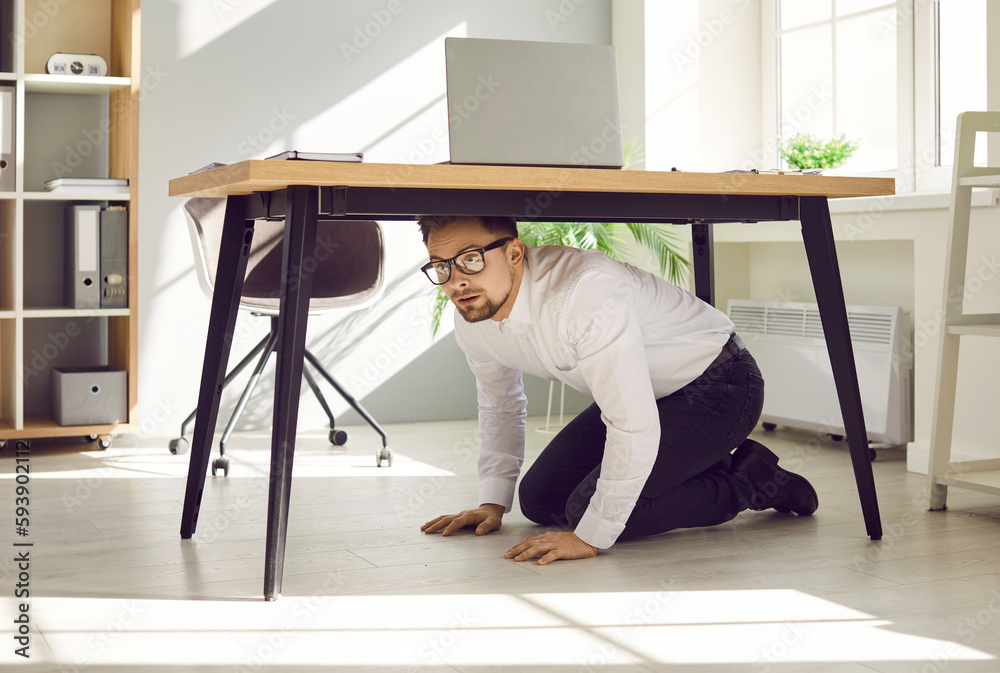 Portrait of a scared stressed young business man with a worried face ...