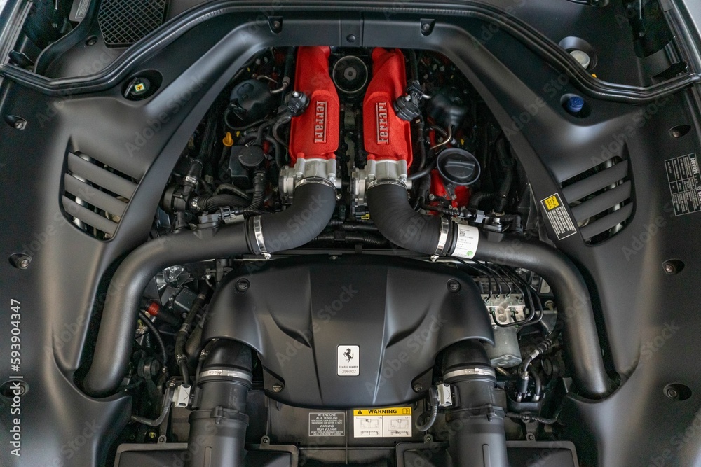 Closeup of Ferrari Portofino Engine Bay, red engine cover, V8 BiTurbo ...