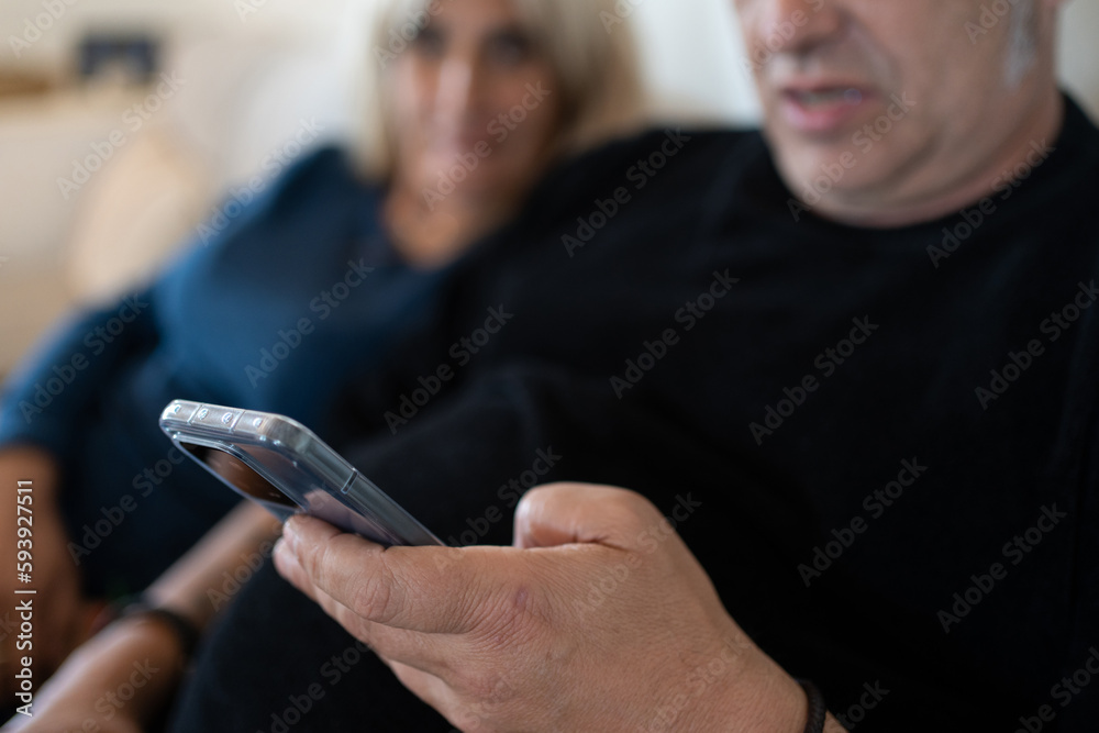 detail of hands with black mobile phone, transparent cover, man talking ...