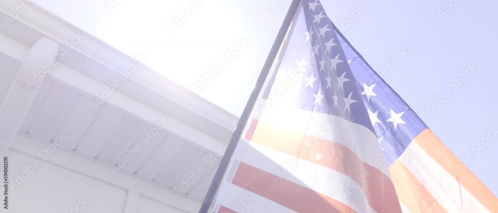 American Flag slow waving motion on a pole. Sunlight. Close-up of the ...