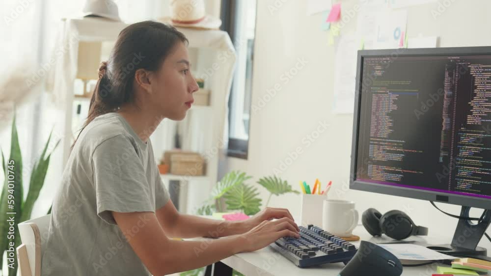 Side view of professional young Asia girl IT development programmer ... Side view of professional young Asia girl IT development programmer ...