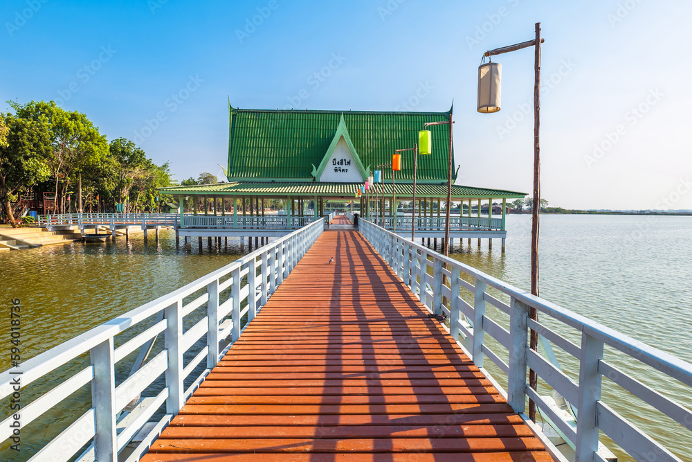 Wood dock and pavilion on the bank of a famous swamp named Bueng Si Fai, a tourist attraction in ...