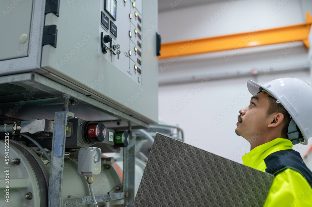 Electrical engineer man checking voltage at the Power Distribution ...