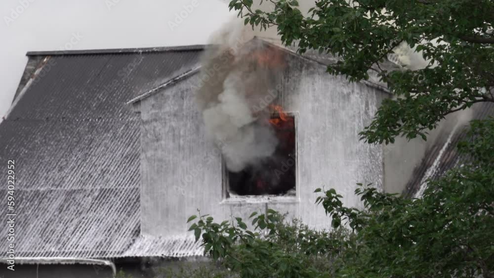Thick smoke billowing from roof of burning house in Reykjavik Iceland ...