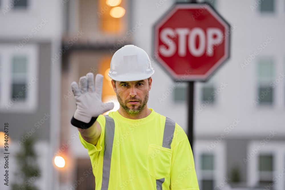 Builder with stop gesture, no hand, dangerous on building concept. Man ...