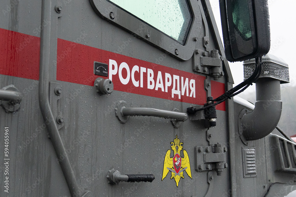 The logo of the Russian National Guard on the car door close-up. Moscow ...