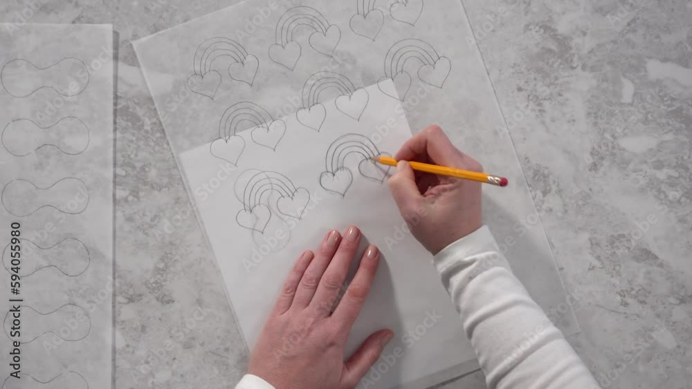 Flat lay. Drawing a template on parchment paper with a pencil for ...