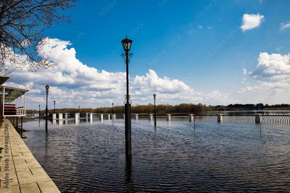 The embankment of the city is flooded with water during the flood of ...