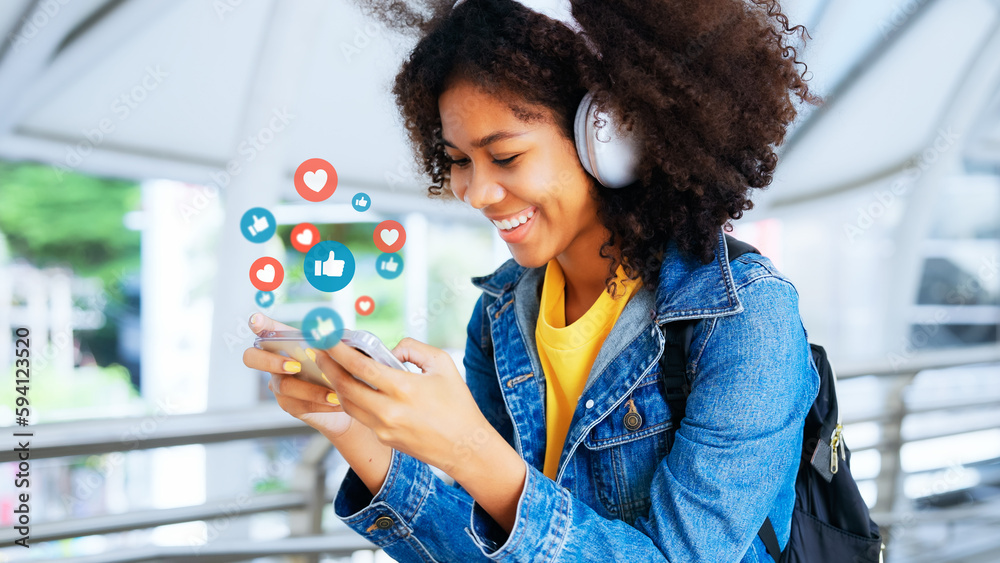 Young black women watching live streaming video and wearing headset ...