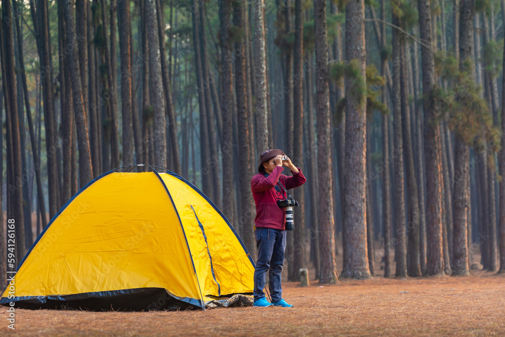Asian naturalist looking at the new discovering bird species while ...