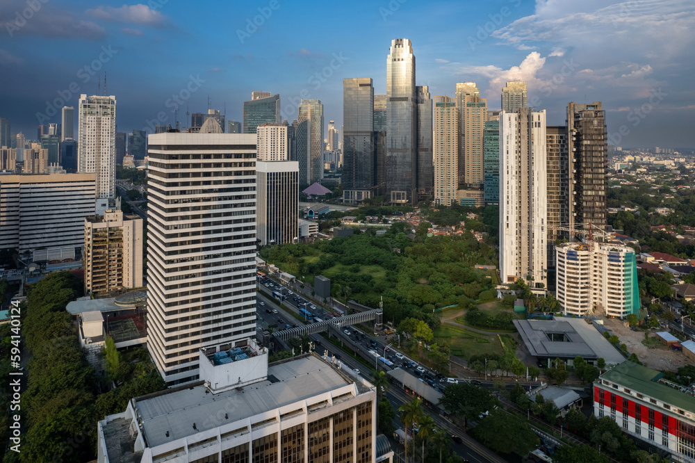aerial shoot of Jakarta skyline during the golden hour. Jakarta is the ...