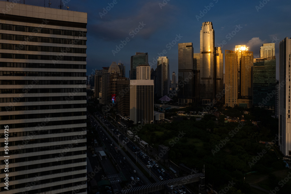 aerial shoot of Jakarta skyline during the golden hour. Jakarta is the ...