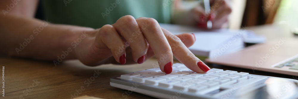 Woman doing calculation of expenses and income and making notes Stock ...
