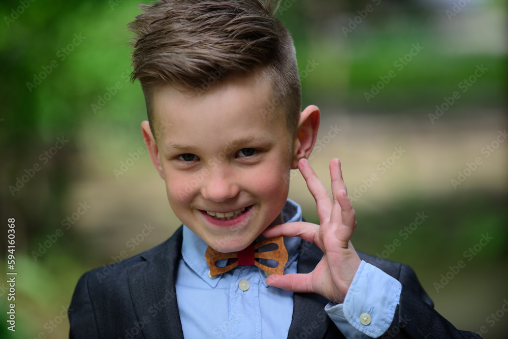 Little fashion portrait of kid boy in suit and bow tie. Lifestyle ...