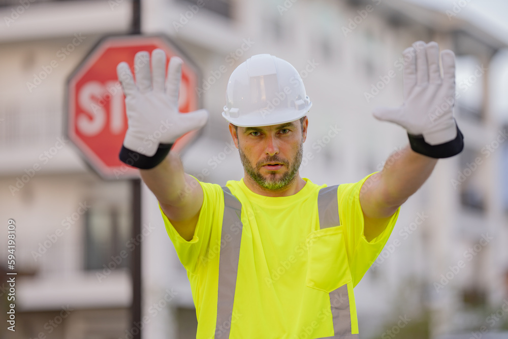 Worker with stop road sign. Builder with stop gesture, no hand ...