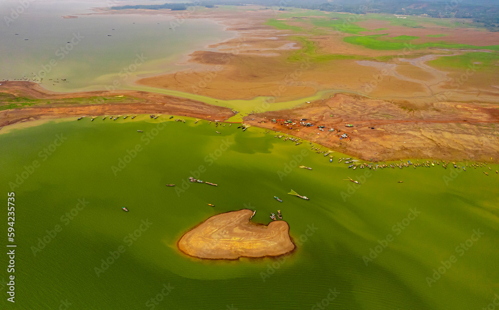 Tri An lake, Dong Nai province, Vietnam in the green algae season has a ...
