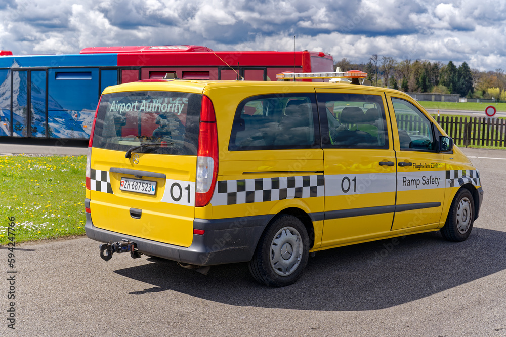 Yellow and black parked van of ramp safety at Swiss Airport Zürich ...