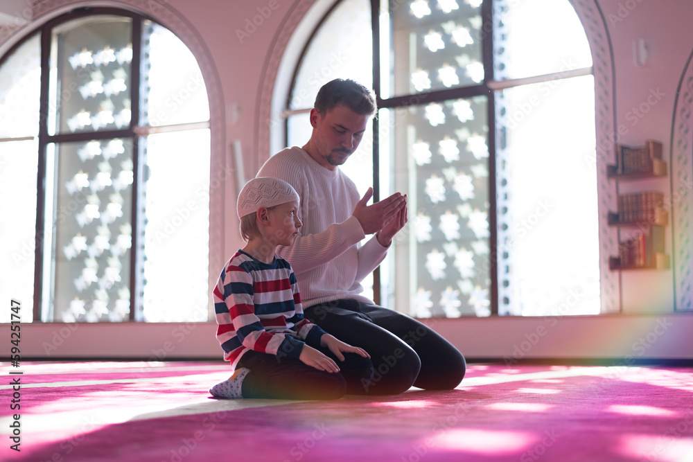 Muslim family praying. Man and childand praying. End of fasting. Hari ...