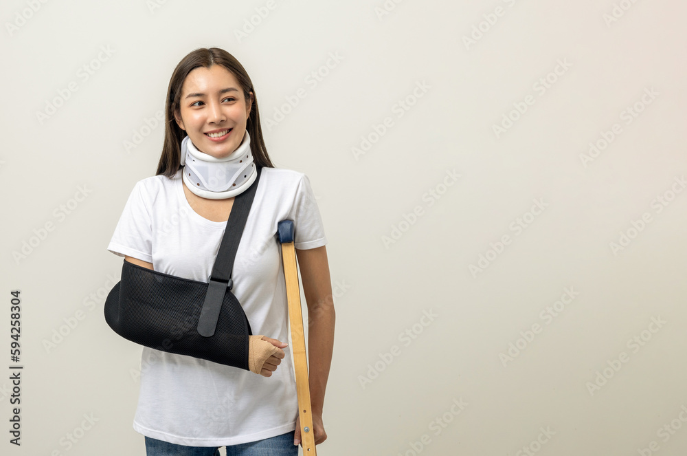 Happy young asian woman broken arm and leg on isolated. Woman put on ...