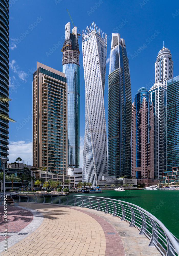 Tall apartment blocks surround the water at Dubai Marina in the UAE ...