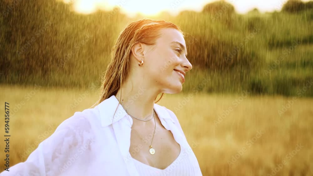 Cinematic shot of stunning girl under rain with beautiful sunset and ...