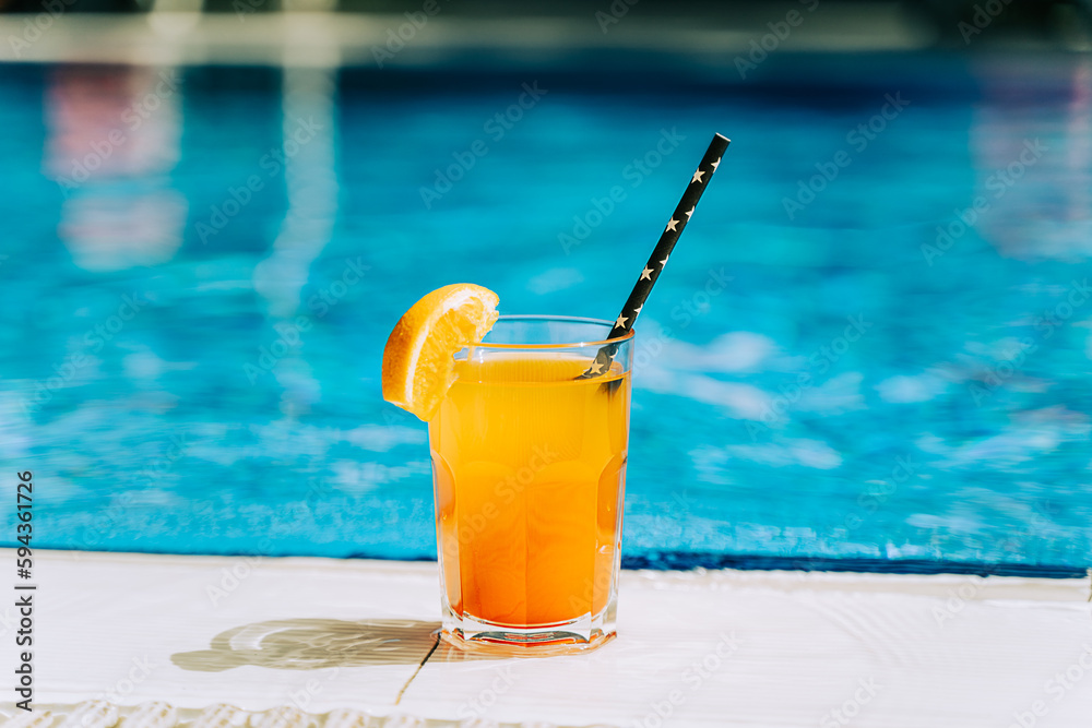Tropical sparkling cocktail by the pool. The picture of glass with ...