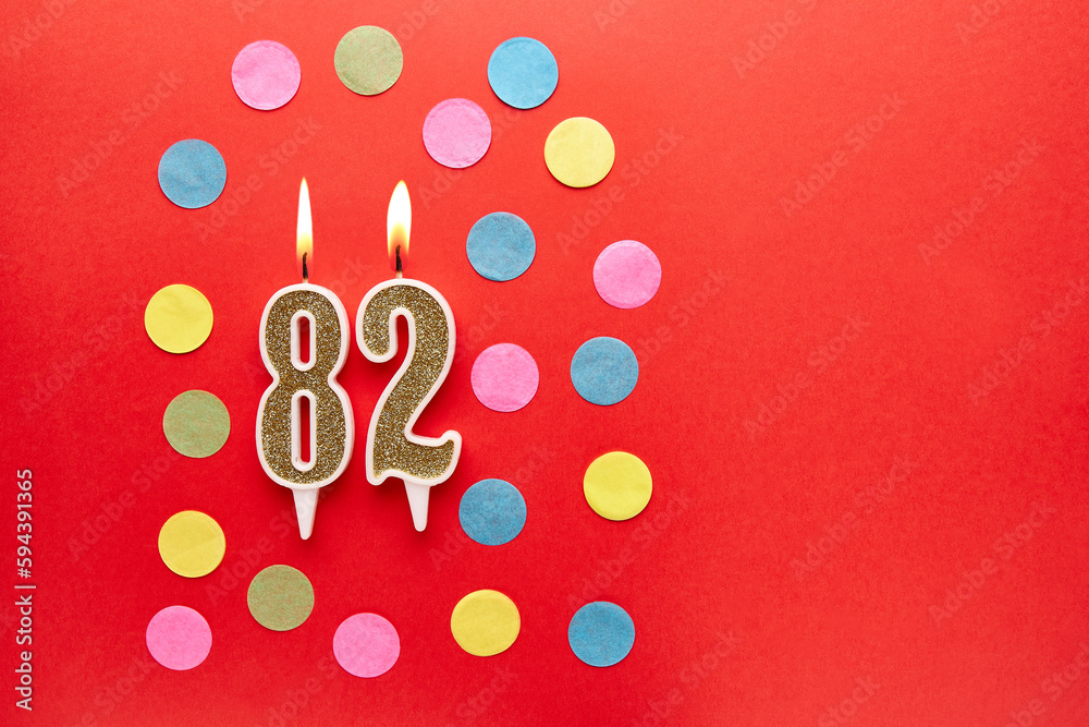 Number 82 on a red background with colored confetti. Happy birthday ...