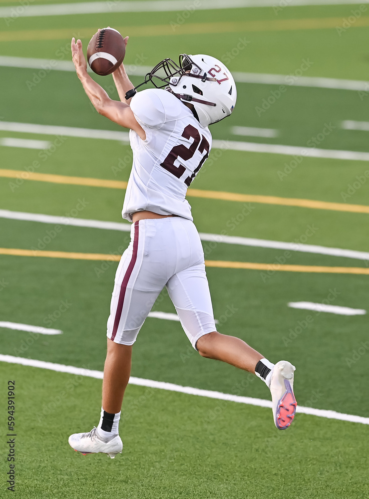 Foto de Young athletic young boys playing in a competitive game of ...