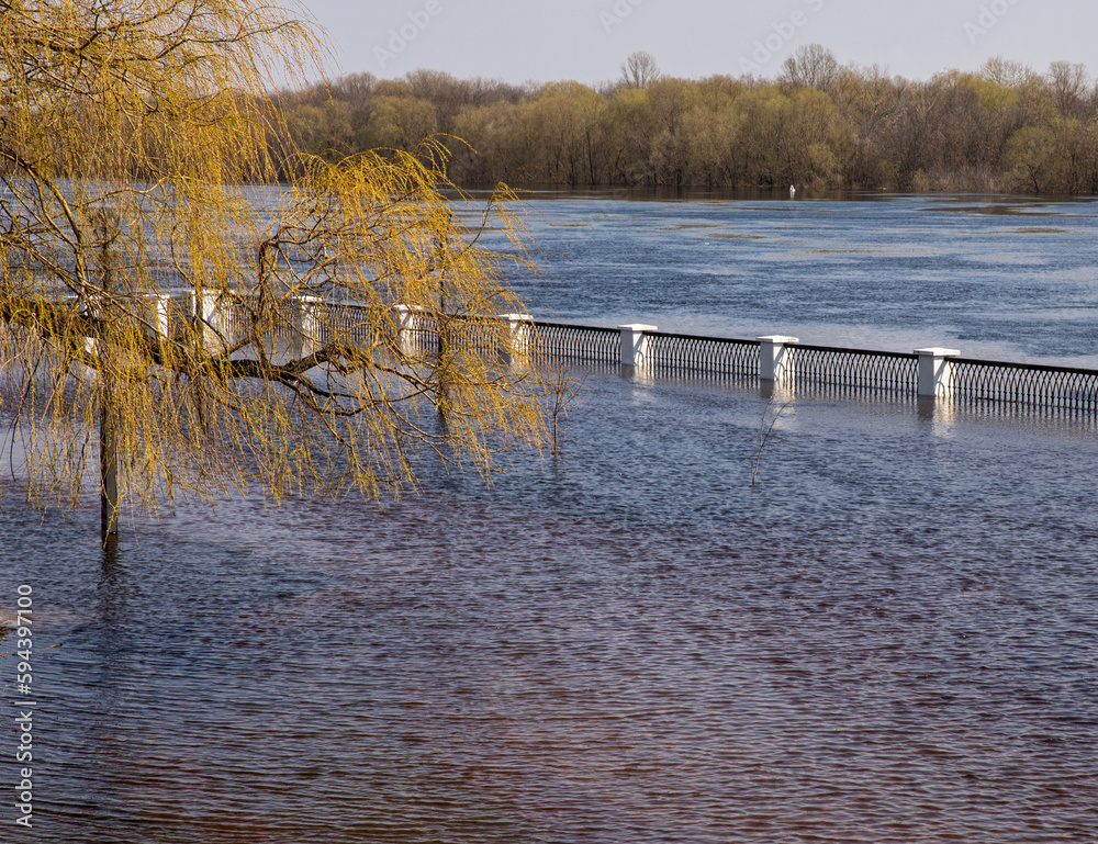 The embankment of the city is flooded with water during the flood of ...