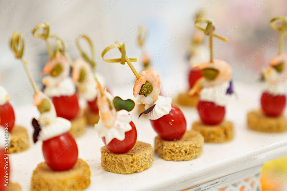 canapes with cherry tomato, shrimp and capers. Stock Photo | Adobe Stock