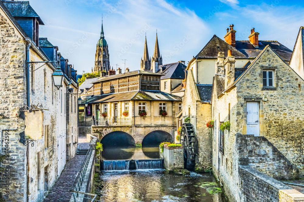 Colorful old buildings, Aure River reflection, Bayeux, Normandy, France ...