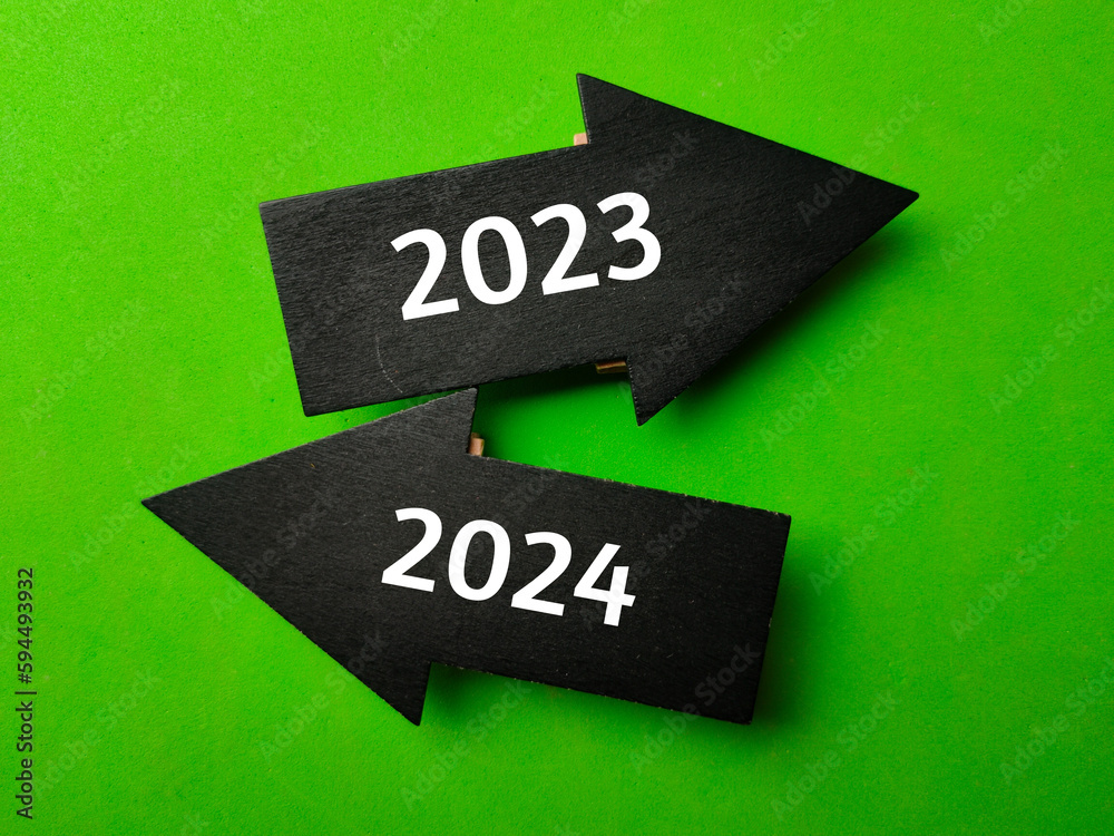 Wooden black arrow with number 2023 and 2024 Stock Photo | Adobe Stock