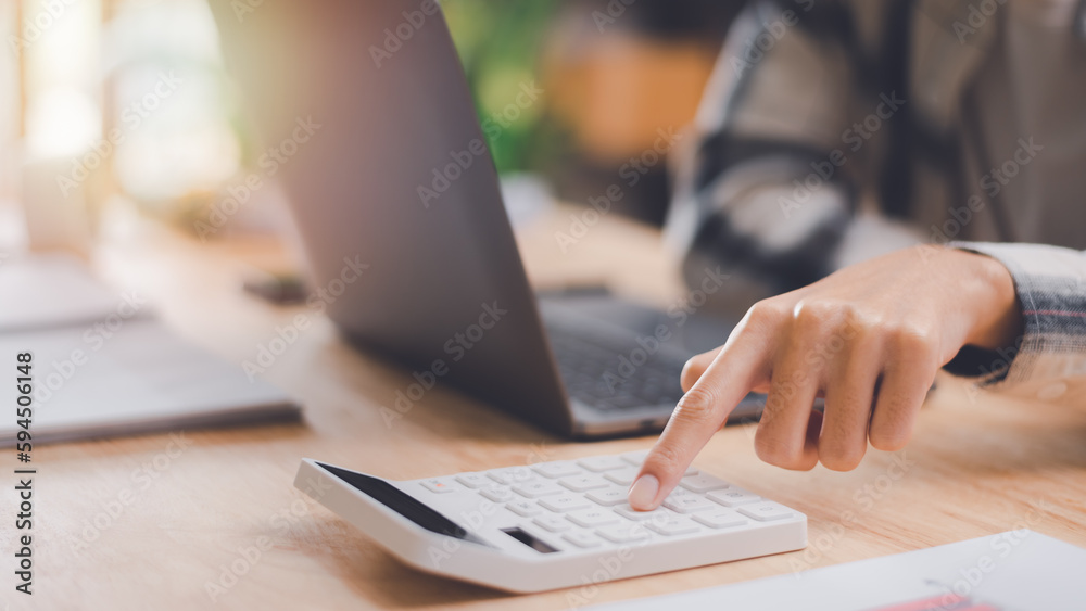 Businessman using a calculator to calculate numbers ,profit and loss ...