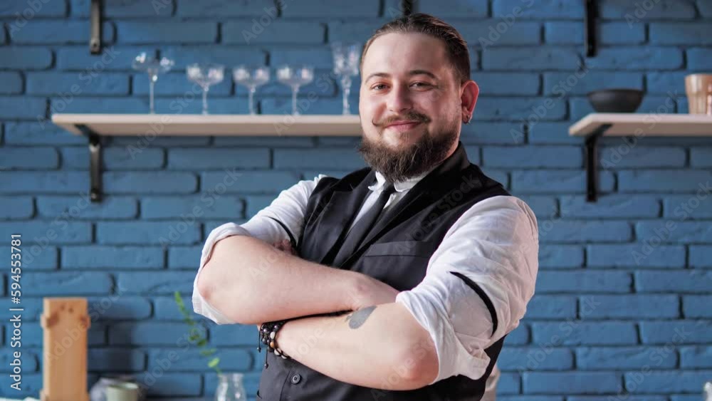 Behind the bar counter, a charming and charismatic bartender with a big ...