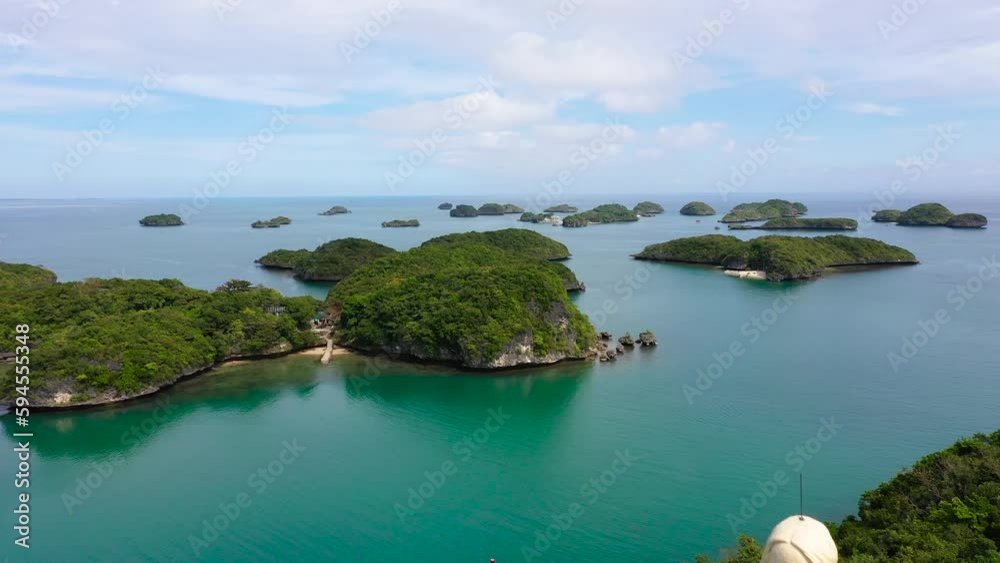 Aerial view of the hundred Islands national Park and the statue of ...