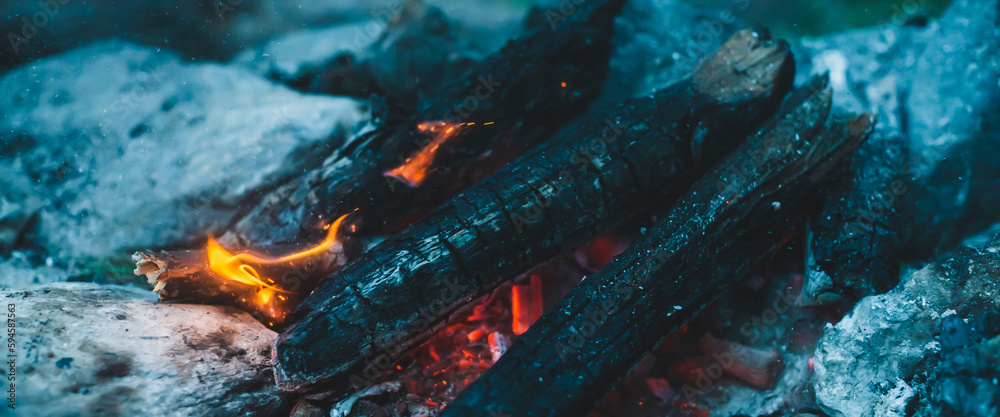 Vivid smoldered firewoods burned in fire close-up. Atmospheric warm ...