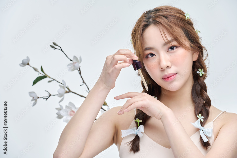 Beautiful Young Asian woman behind flower in beauty pose. Pretty girl ...