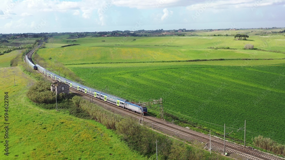 Trains run through the green hills, sustainable, fast and economical ...